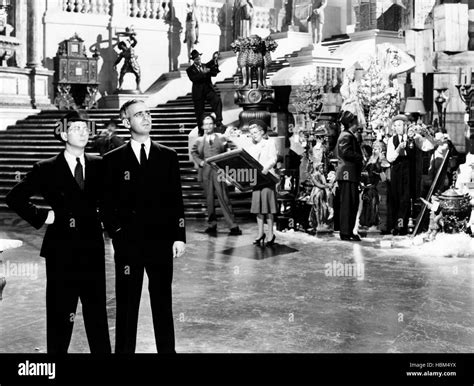 CITIZEN KANE From Left William Alland Paul Stewart Alan Ladd