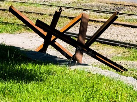Rusty Anti Tank Hedgehogs On The Grass In The Frontline Zone War In