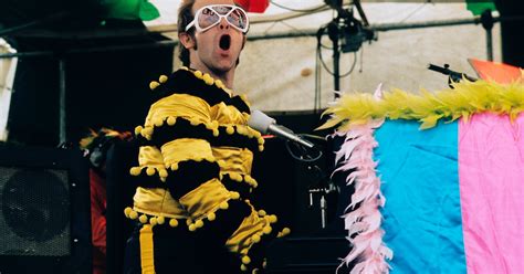 A Visual History Of Elton Johns Flashiest Larger Than Life Looks
