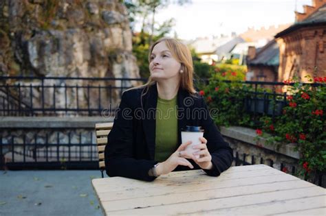 Business Caucasian Woman Wear Suit Sits With Smartphone And Coffee Cup