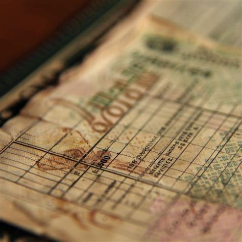 A Closeup Of A Paycheck Stub Showing Salary Deductions And Benefits