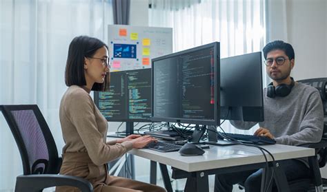 asian woman and indian man developer team working about programming