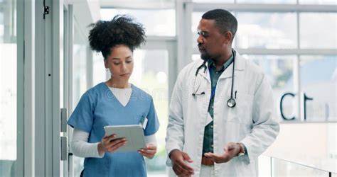 Doctor Nurse And Planning On Tablet For Healthcare Research Hospital