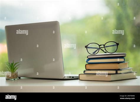 Object Education Green Nature Background With Stack Of Ancient Books Or Old Bible Open Paper