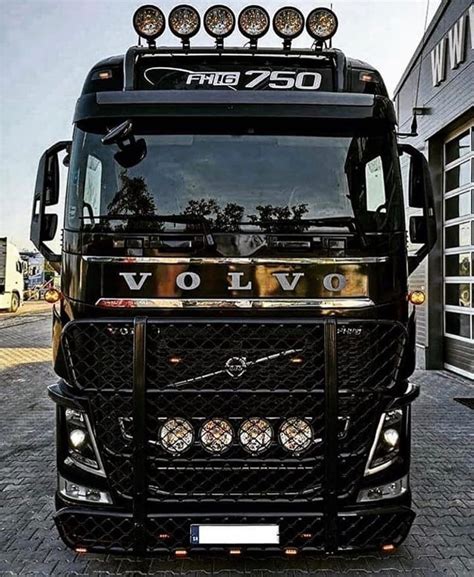 Black Volvo Truck On Brick Road