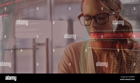 Caucasian Female Wearing Glasses Focusing On Coding On Computer Stock