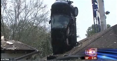 Airborne Car Crash Lands Into Roof Of Occupied Home As Awestruck