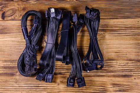 Premium Photo Set Of Computer Psu Cables On A Wooden Background