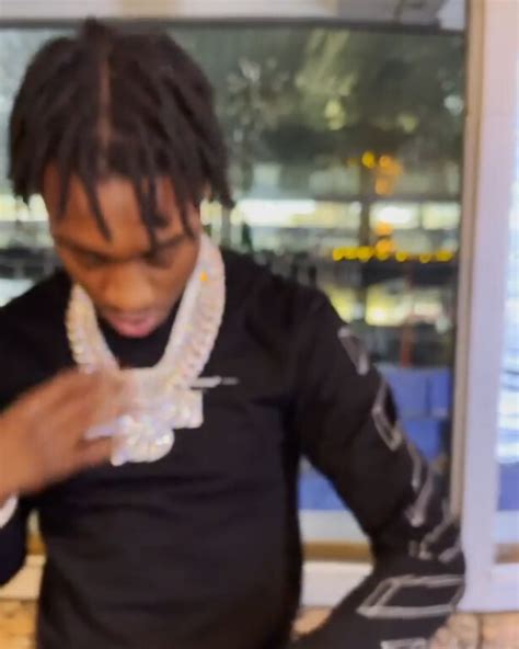 Lil Tjay Wearing An Off White Long Sleeve Black Tee Inc Style