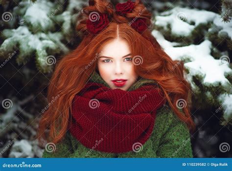 Beautiful Blue Eyed Red Haired Smiling Girl Posing In Front Of Snow