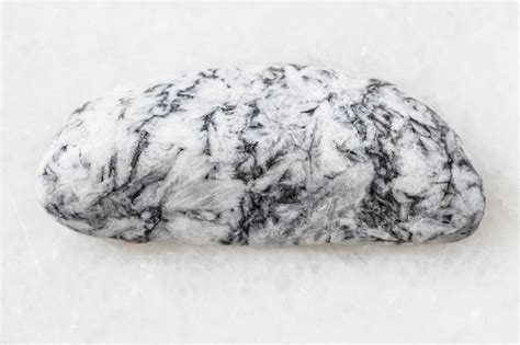 Premium Photo Tumbled Magnesite Rock On White Marble