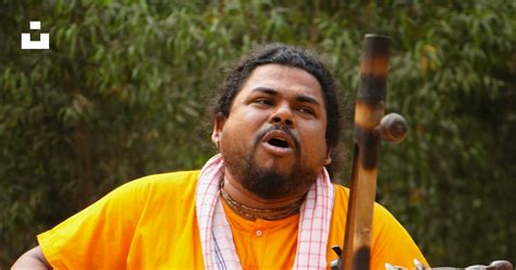 A Musician Plays A Traditional String Instrument Photo Free Man Image On Unsplash