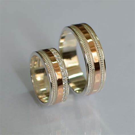 Парні обручки зі срібла з золотими вставками Купити обручки пара Alexandro Biju K