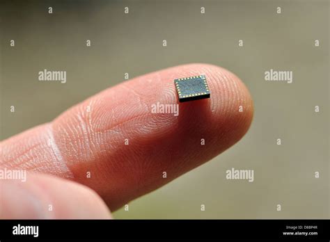 Miniature MEMs Device On Human Finger Stock Photo Alamy