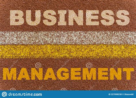 On The Treadmill The Words Business And Management Are Separated By