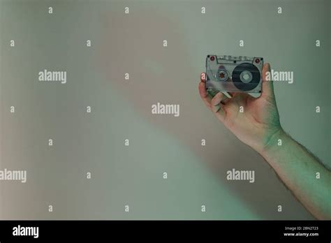 Hand Holding Audio Cassette Tape In The Color Light Beautiful Minimal