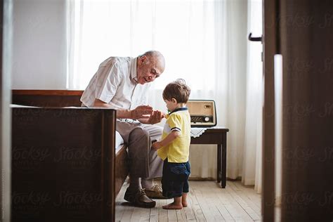 Grandfather With His Grandson By Stocksy Contributor Nasos Zovoilis