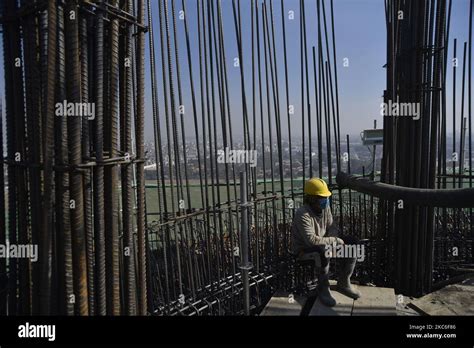 A Worker Takes Rest On The Under Construction Historic Dharahara Tower