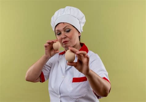 Free Photo Thinking Middle Aged Female Cook In Chef Uniform Looking
