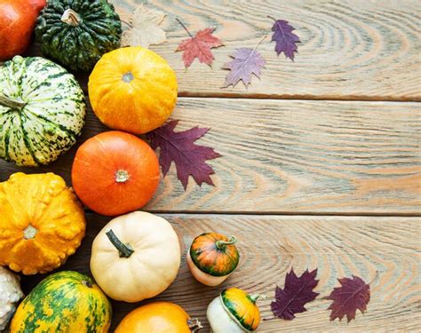Premium Photo Pumpkins On A Wooden Table
