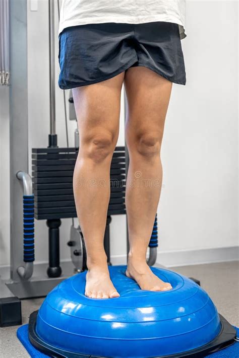Balance Exercise With Bosu Ball Woman And In A Gym Stock Image