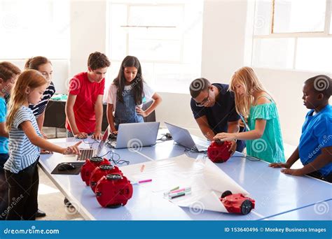 Group Of Students In After School Computer Coding Class Learning To