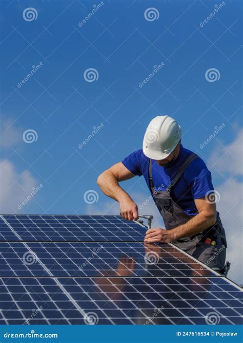 Man Worker Installing Solar Photovoltaic Panels On Roof Alternative