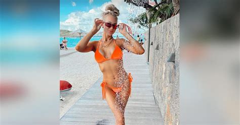 Christine Quinn Shows Off Fit Physique In Orange Bathing Suit Photos