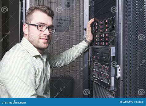Network Engineer Working In Server Room Stock Photo Image Of Network