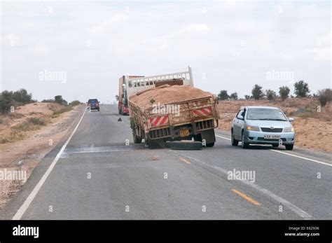 Traffic Passing Broken Down Truck Lorry With Broken Rear Spring On