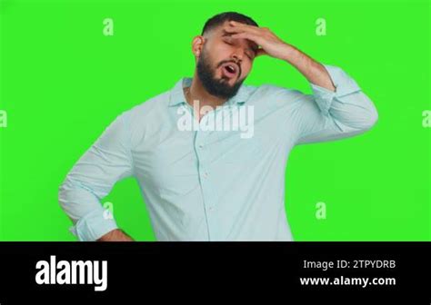 Displeased Exhausted Indian Man Guy Rubbing Temples To Cure Headache