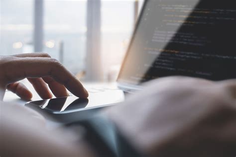 Premium Photo Computer Programmer Mobile App Developer Using Mobile