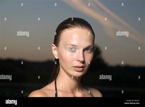 Closeup Portrait Of Attractive Young Woman With Wet Hair On Beach Stock