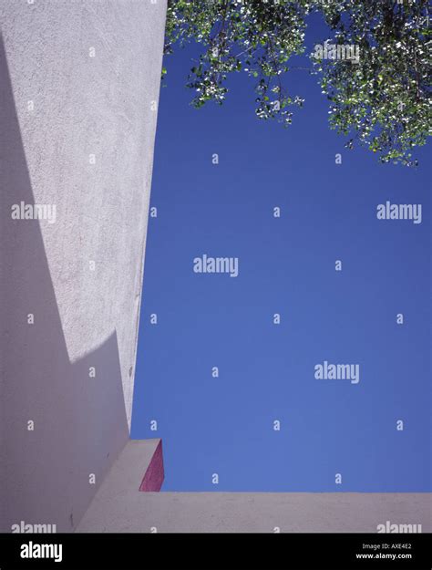 Modern Architecture With White Angular Walls Contrasting With Blue Sky