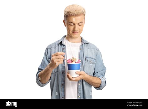 Guy With Bleached Hair Eating Ice Cream In A Paper Cup Isolated On