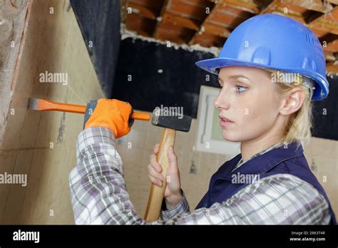 Female Builder With Hammer And Chisel Stock Photo Alamy
