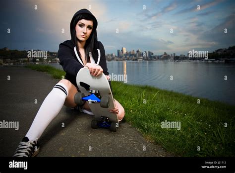 A Beautiful Caucasian Skater Teen Girl Outdoor During The Sunset Stock