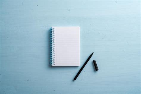 Premium Photo Top View Of Blank Notepad With Black Marker