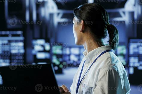 System Administrator In Data Center Uses Laptop To Prevent System