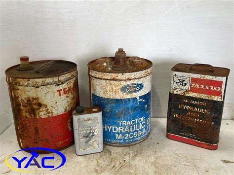 4 Vintage Oil Containers YAC Auctions