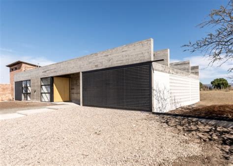 House By Tectum Features Raw Concrete Walls And Black Metal