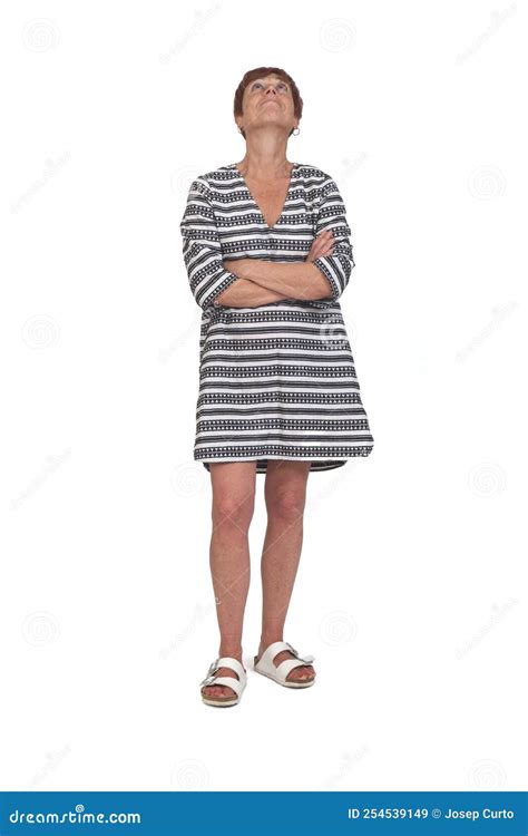 Middle Aged Woman Looking Up In A Summer Dress On White Background