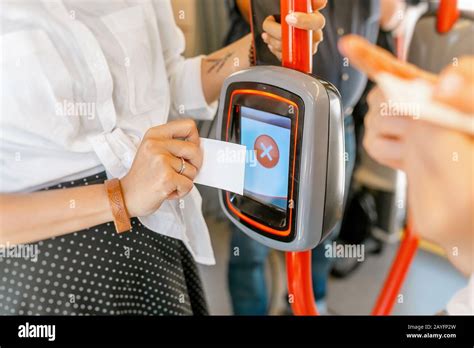Woman Trying To Validate Electronic Ticket In Public Transport And