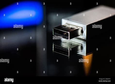 Usb Memory Stick Bluetooth Connection Adapter On A Mirrored Background
