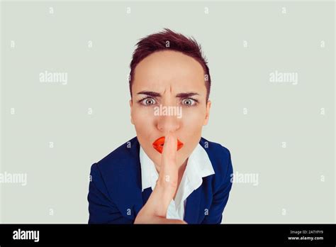 Angry Woman Wide Eyed Asking For Silence Or Secrecy With Finger On Lips