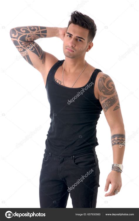 Handsome Tattooed Young Man Wearing Black Tank Top Standing Isolated