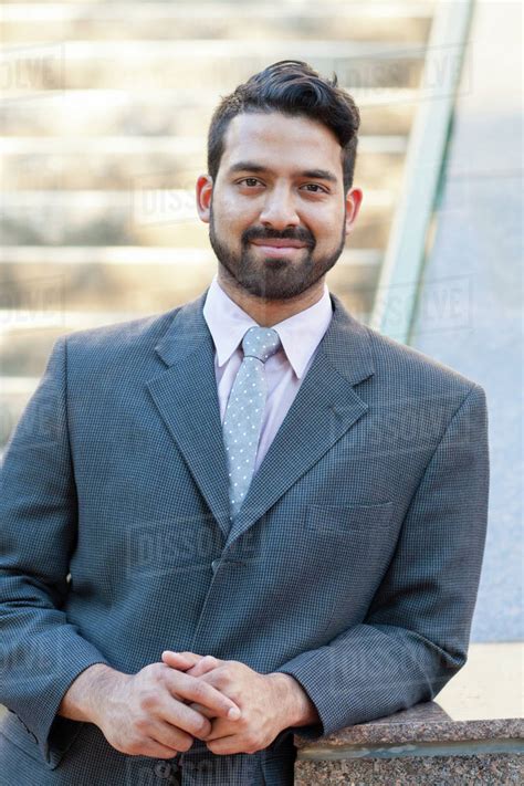 Indian Businessman Smiling Outdoors Stock Photo Dissolve