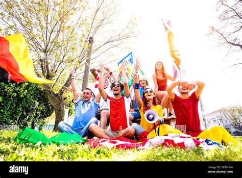 Young Football Supporter Fans Cheering With International Flags At