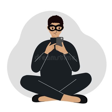 Hacker In A Black Mask With A Mobile Phone The Cybercriminal Is