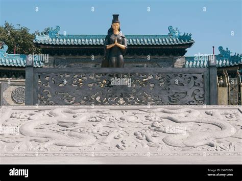 A Large Stone Mural In Front Of The Goddess Of The Sea Tian Hou At